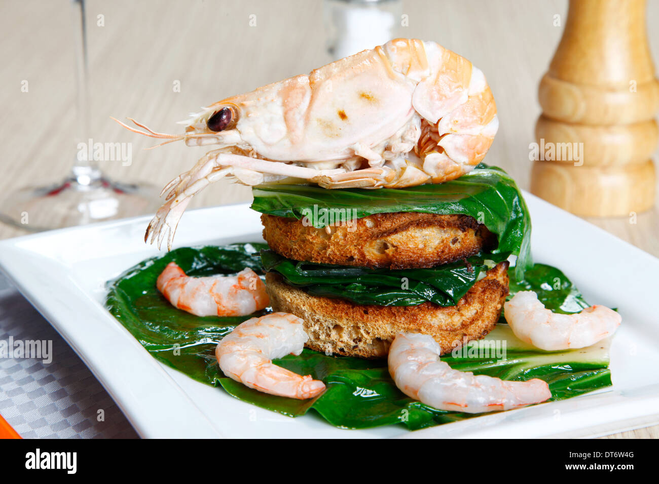crayfish on a toast with vegetables on a dish Stock Photo - Alamy