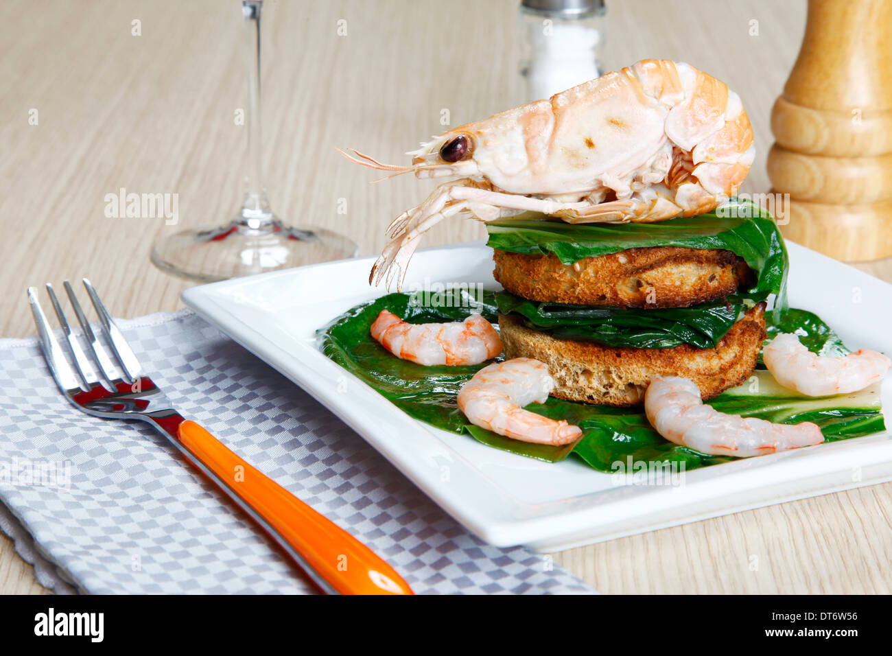 crayfish on a toast with vegetables on a dish Stock Photo - Alamy