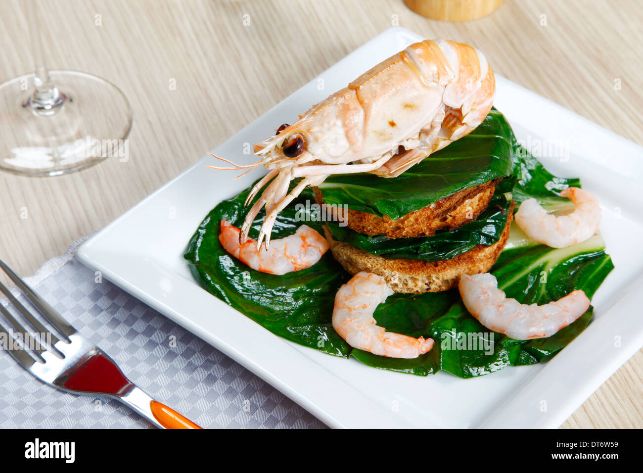 crayfish on a toast with vegetables on a dish Stock Photo - Alamy