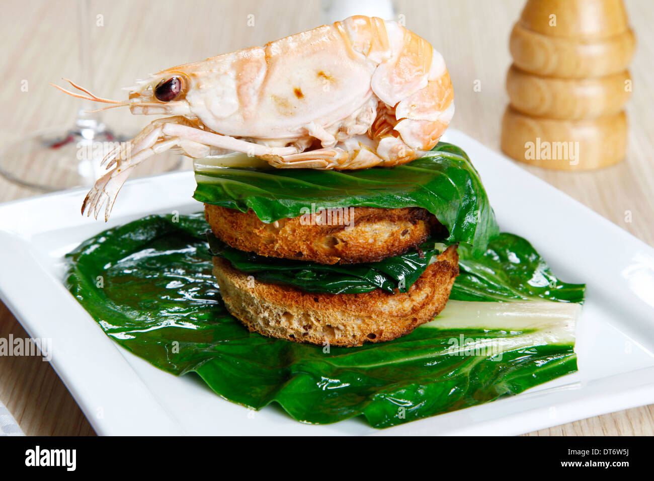 crayfish on a toast with vegetables on a dish Stock Photo - Alamy