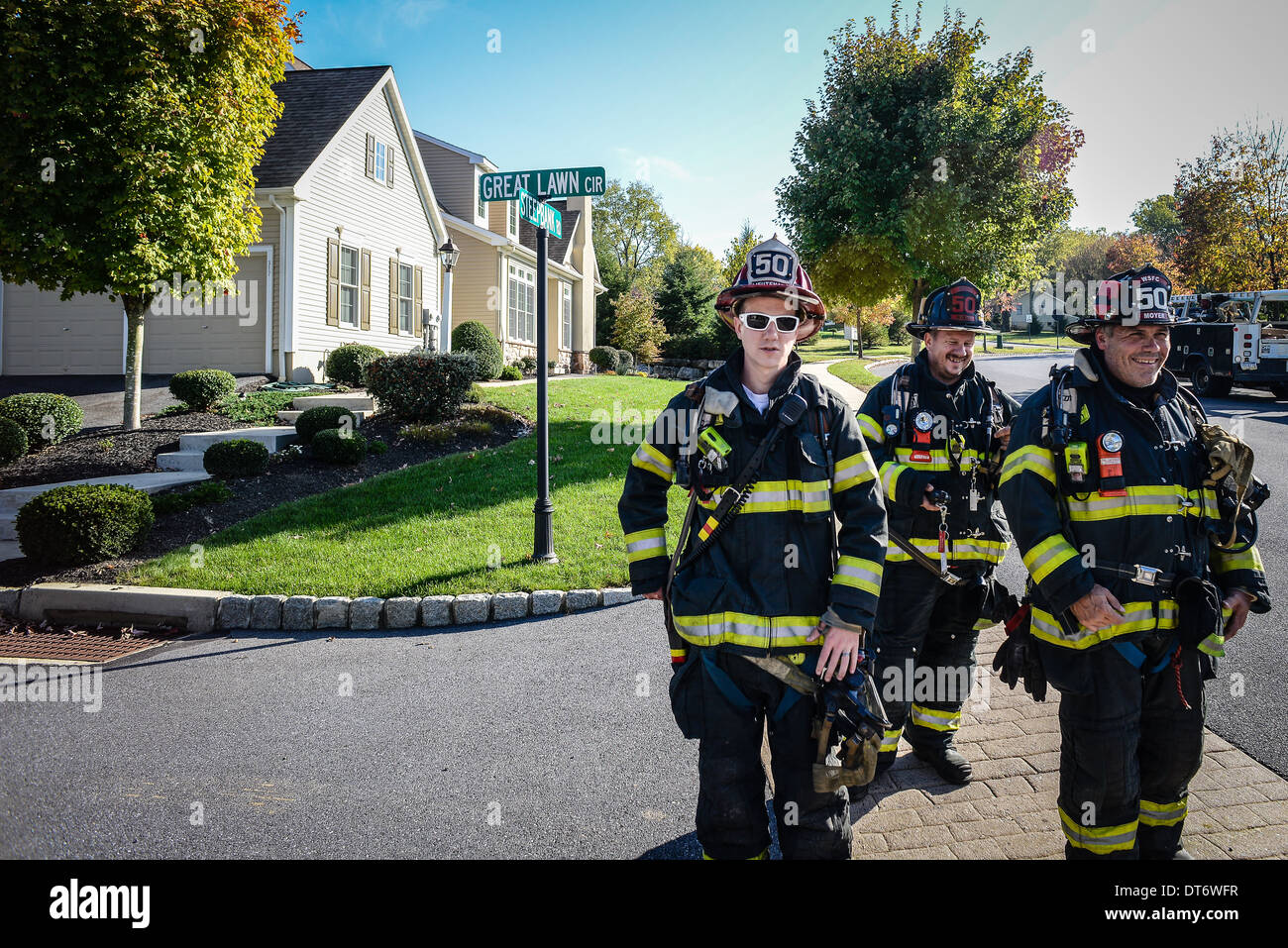 Group of volunteer firemen Stock Photo - Alamy
