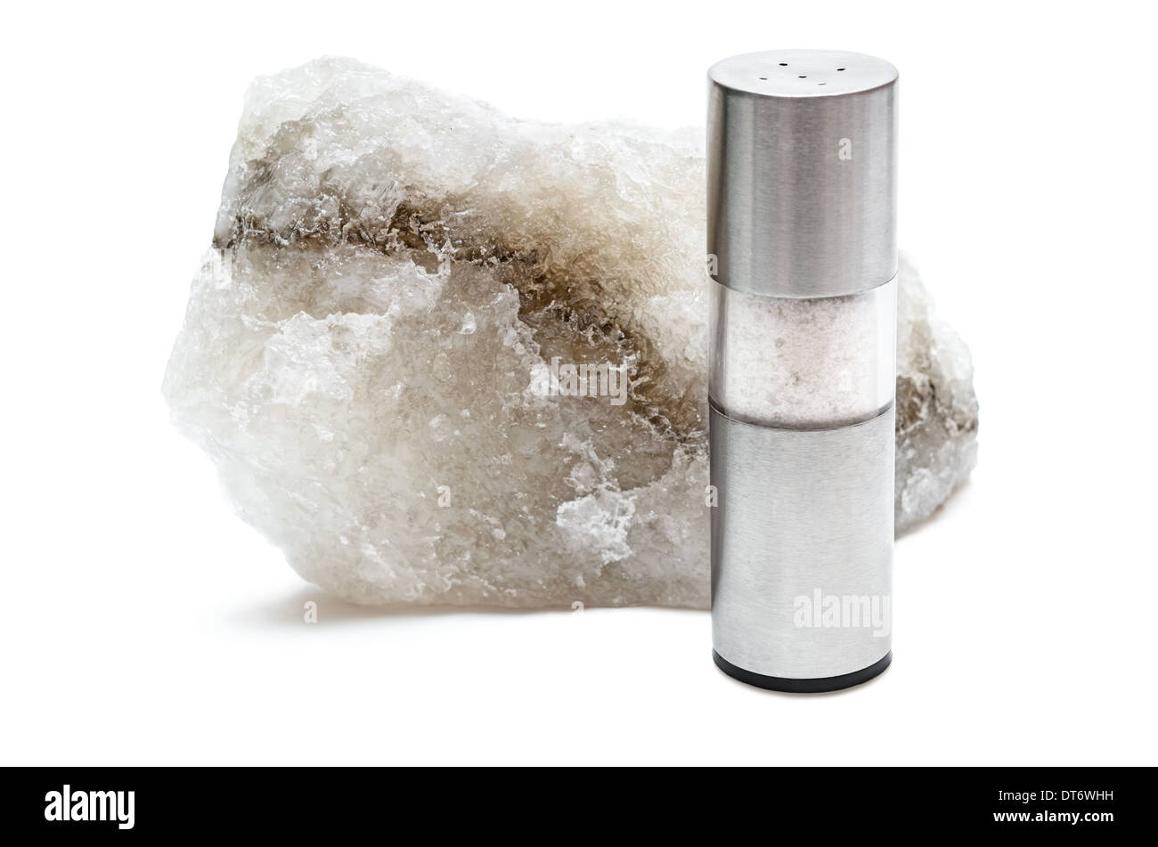 Rock salt with saltshaker isolated on white background Stock Photo - Alamy