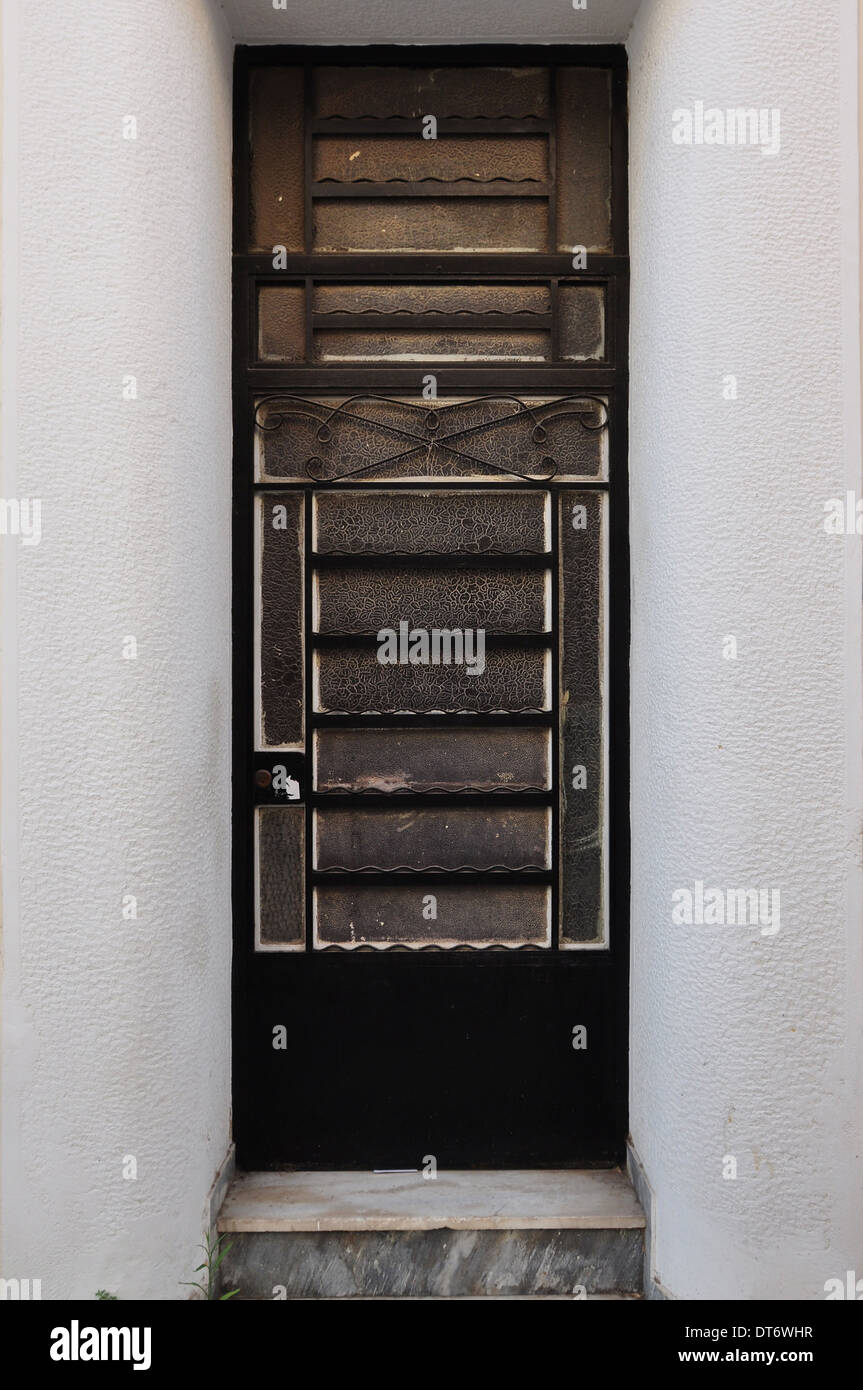 Old metal door frame with abstract classic pattern. Architectural ...