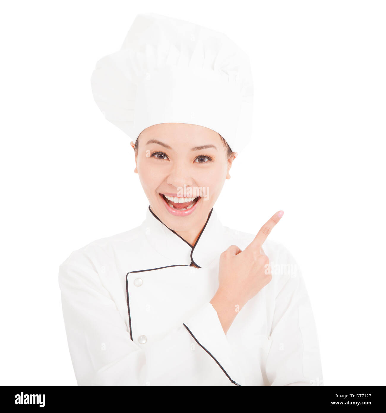 Portrait of young woman chef pointing direction on white Stock Photo ...