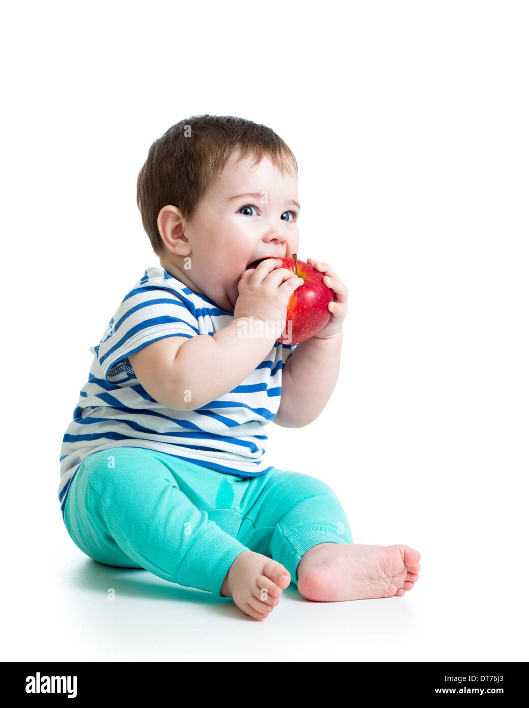 Baby boy eating red apple, isolated on white Stock Photo - Alamy