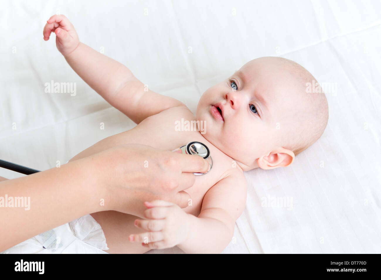doctor examining baby with stethoscope Stock Photo - Alamy