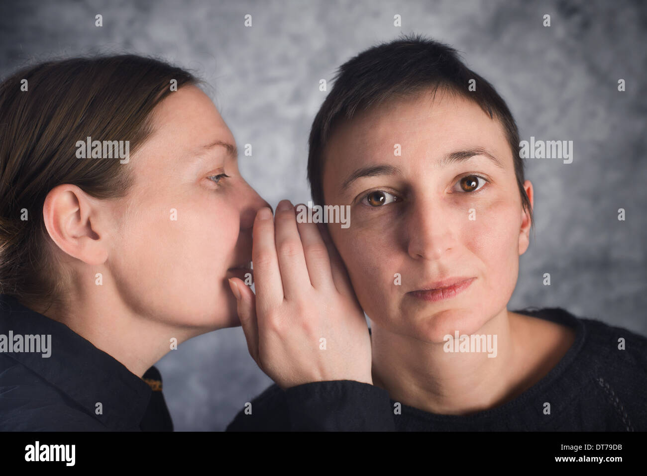 Telling secrets hi-res stock photography and images - Alamy