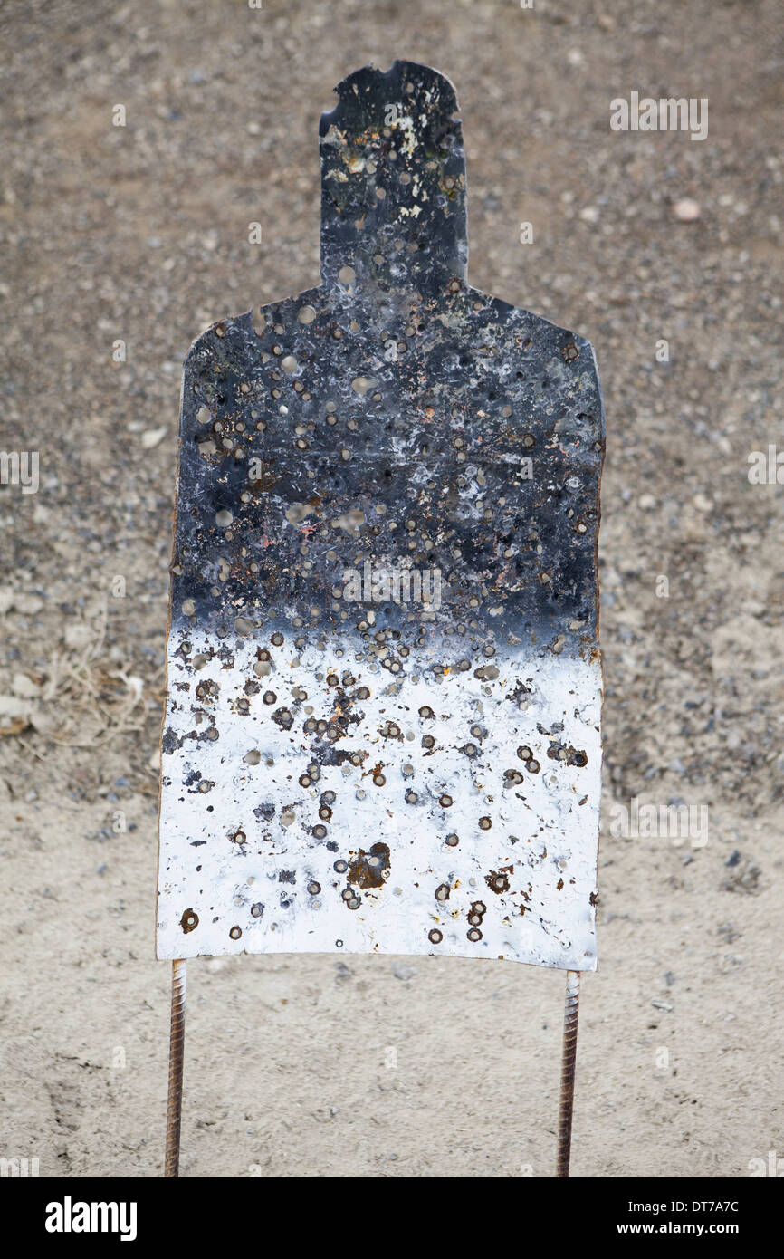 A firing practice target in the shape of a person on a desert firing ...