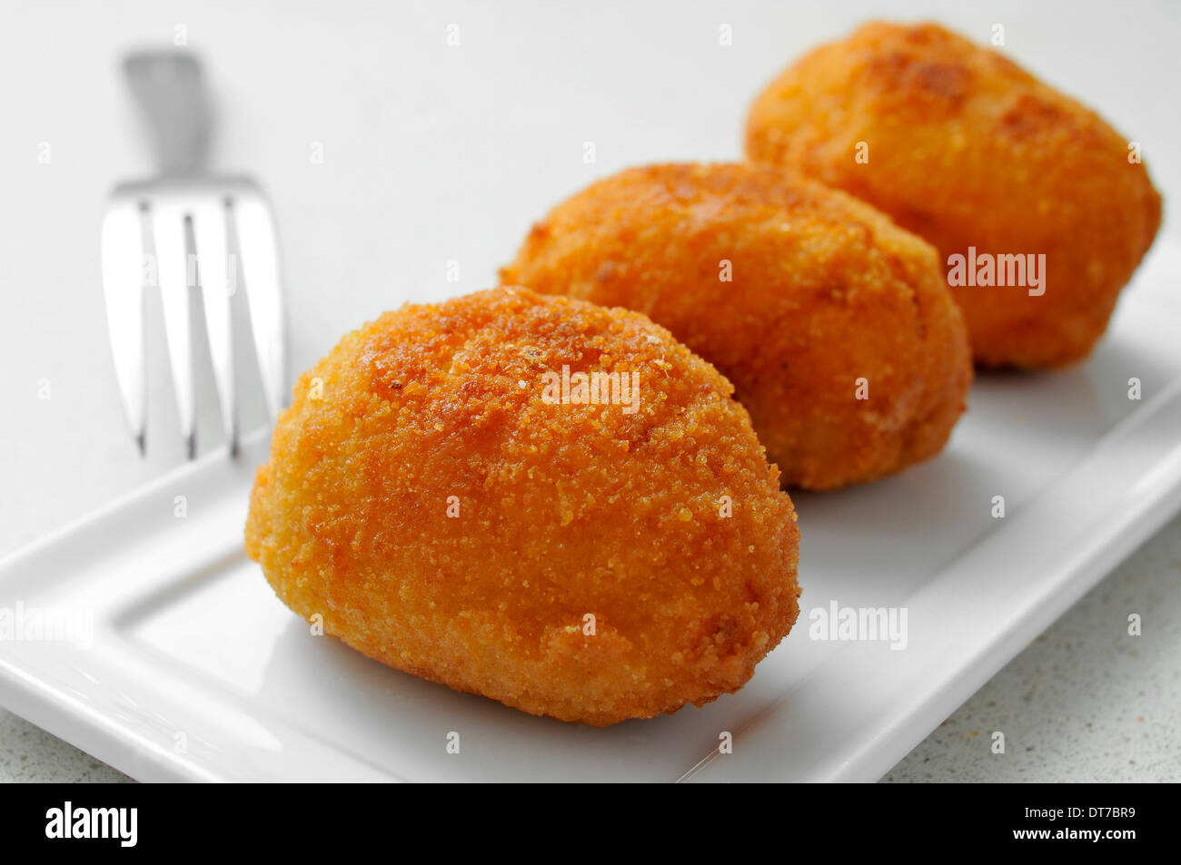 closeup of a plate with croquetas, spanish croquettes, on a granite ...