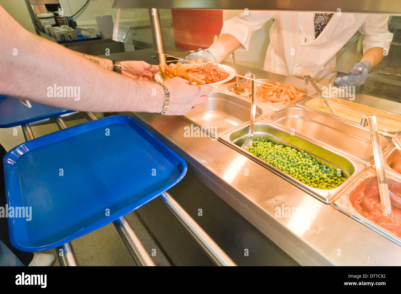 Detail of person being served in cafeteria Stock Photo - Alamy