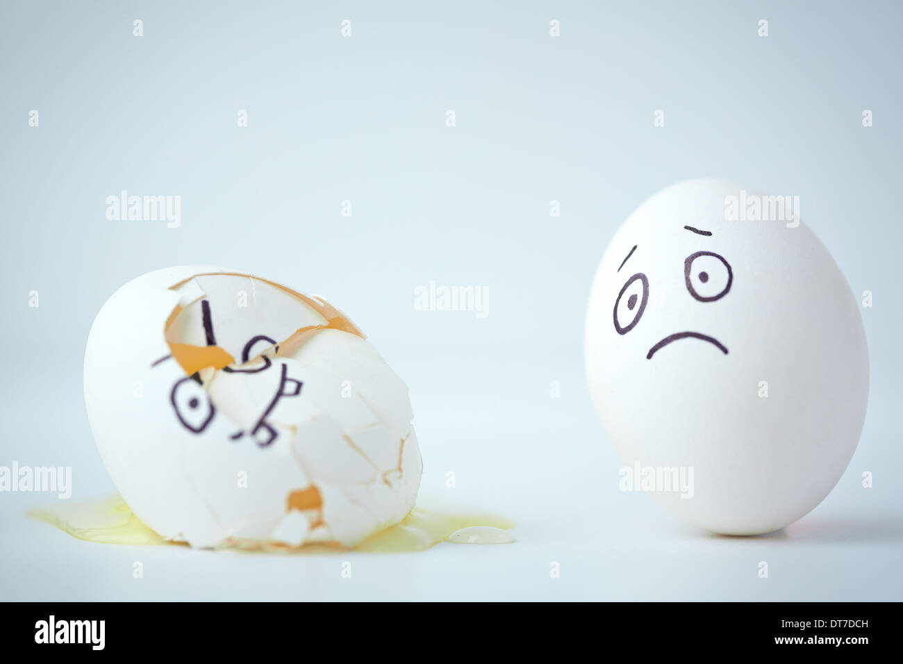 Sad Easter egg with broken one near by Stock Photo - Alamy