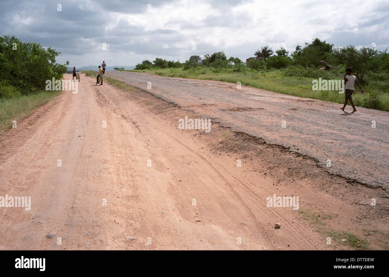 a dust road runs along side of the potholed and un usable origonal tar ...