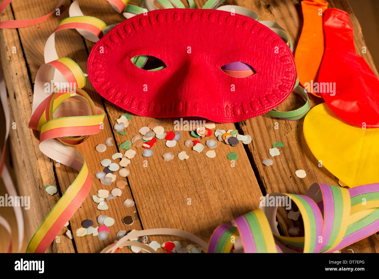 Still life with carnival mask and colored glitter Stock Photo - Alamy