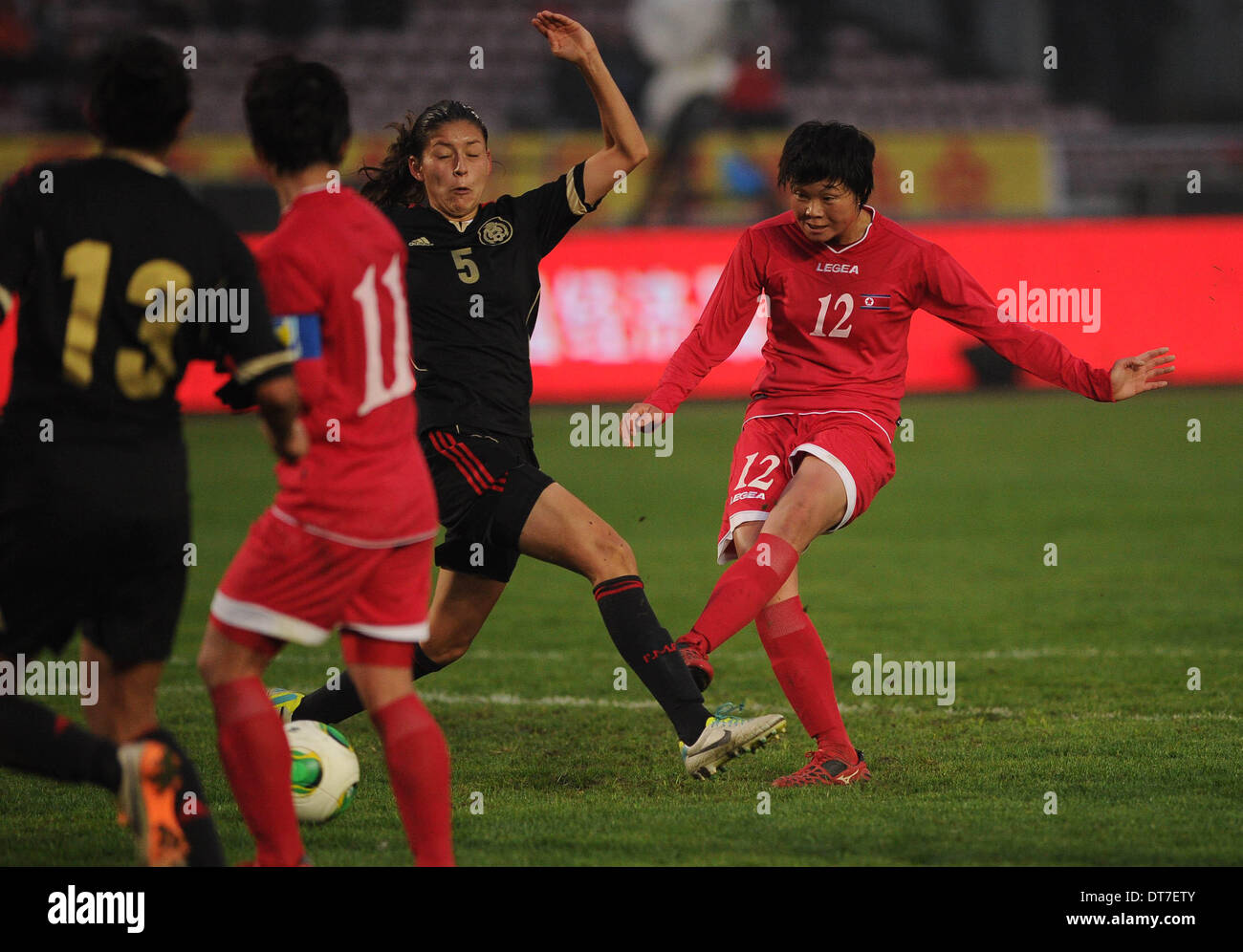 Chongqing, China. 11th Feb, 2014. Kim Yunmi (R) of the Democratic ...