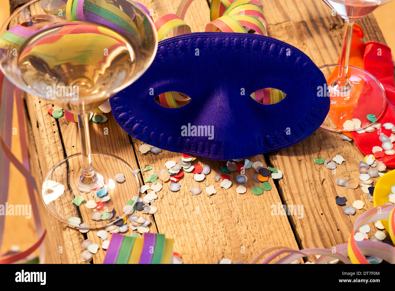 Still life with carnival mask and colored glitter Stock Photo - Alamy