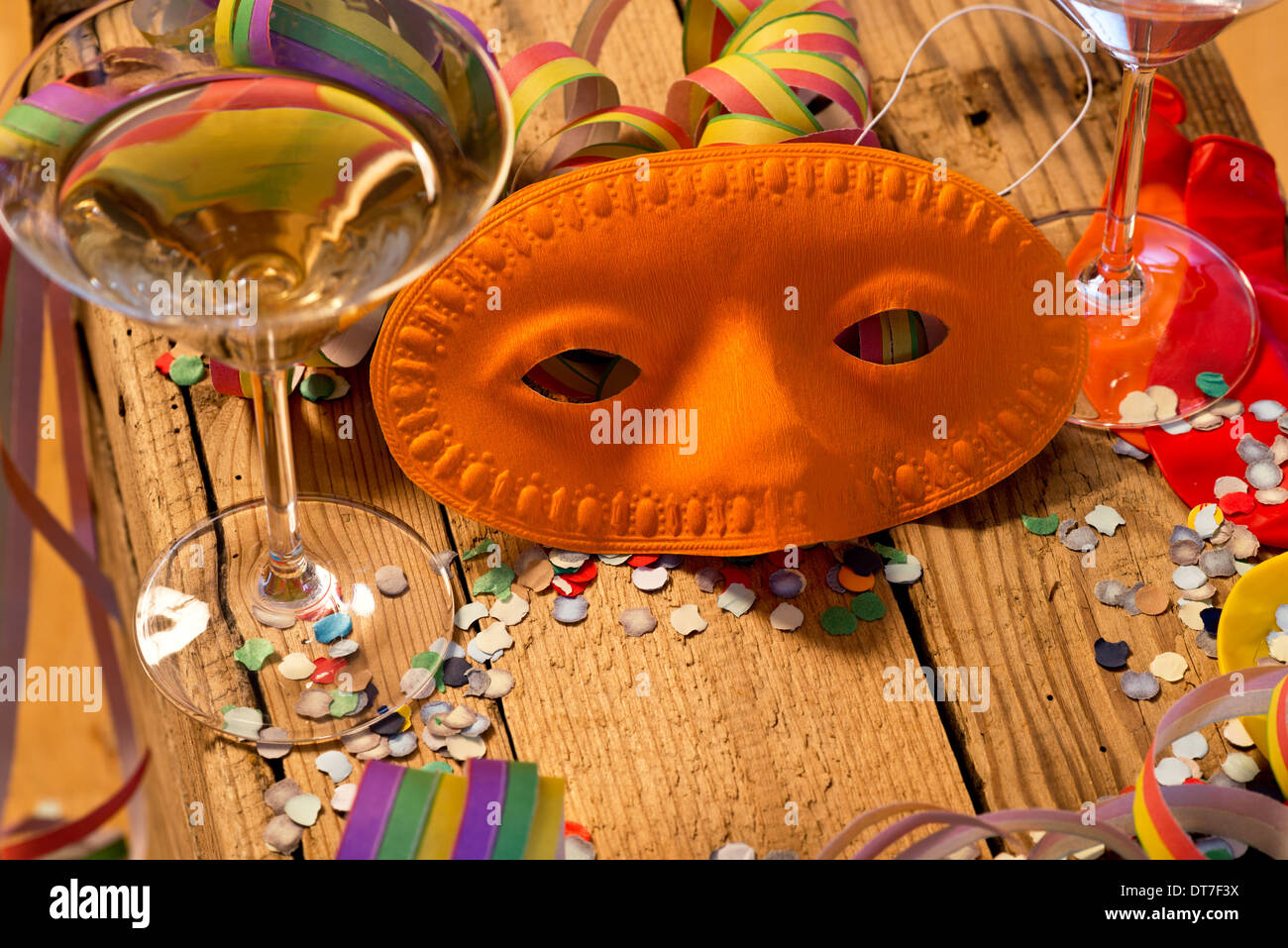 Still life with carnival mask and colored glitter Stock Photo - Alamy