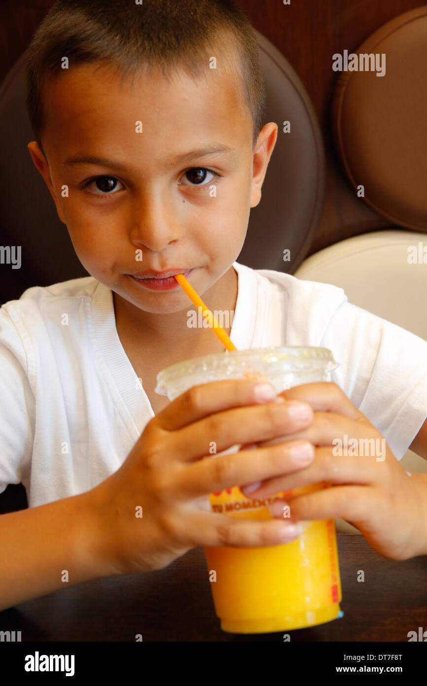 Boy drinking juice Stock Photo - Alamy