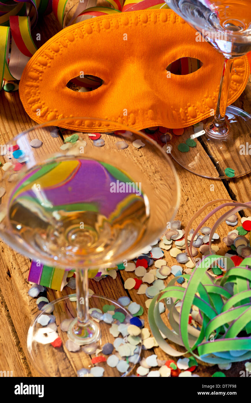 Still life with carnival mask and colored glitter Stock Photo - Alamy