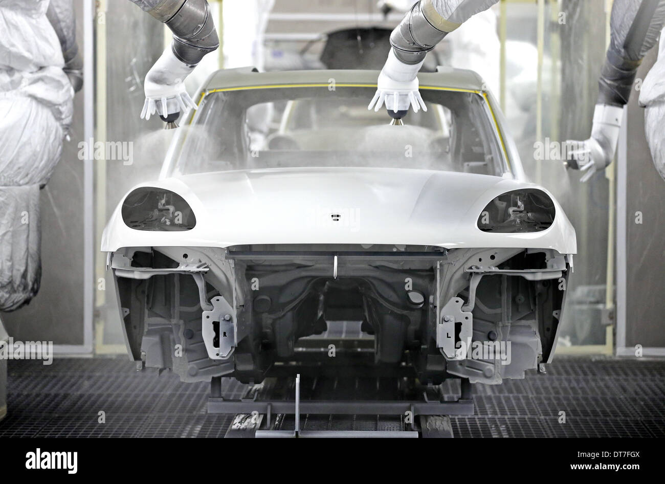 Leipzig, Germany. 05th Feb, 2014. Industrial robots paint the bodywork ...