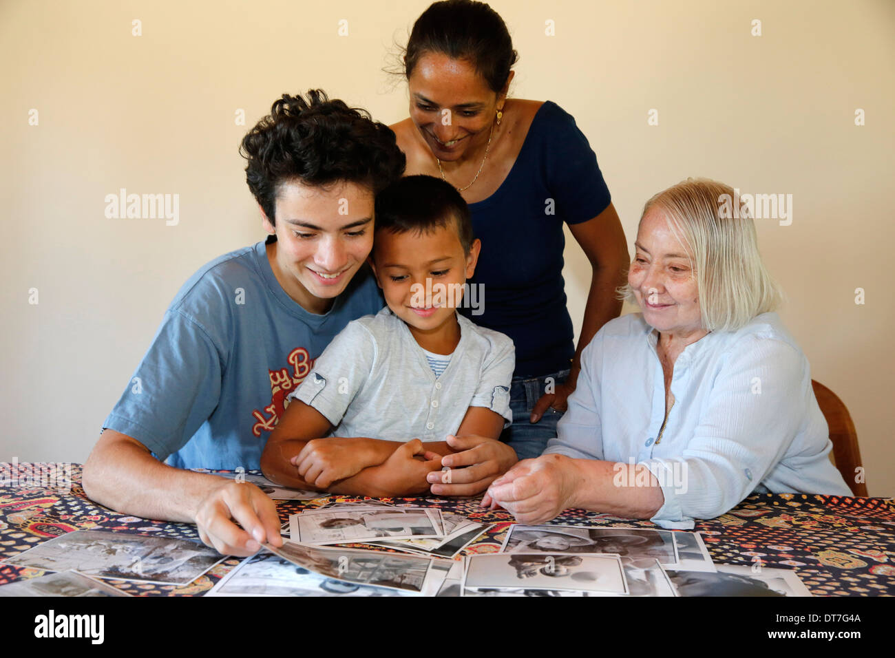 Family looking at photographs Stock Photo - Alamy
