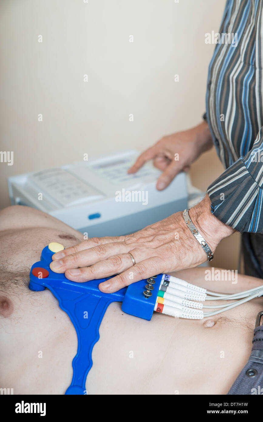 Male patient undergoes ecg electrocardiogram hi-res stock photography ...