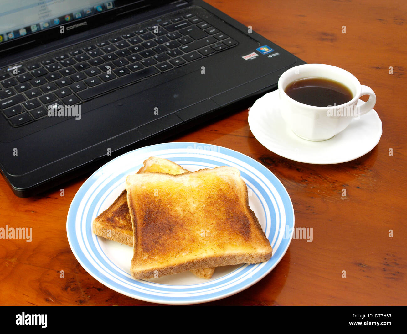 Laptop and breakfast hi-res stock photography and images - Alamy