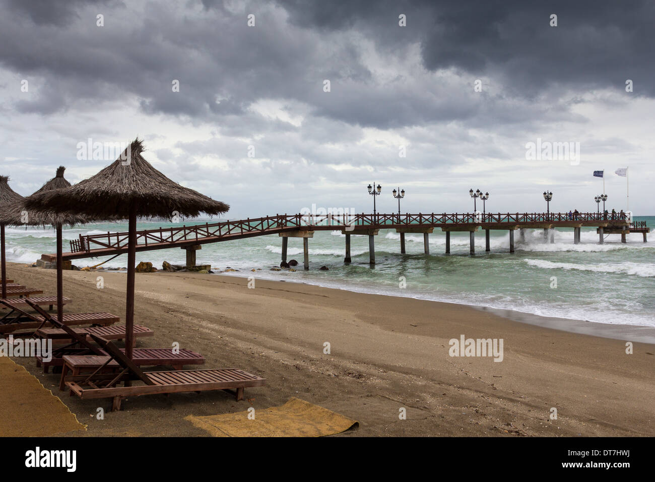 MARBELLA COSTA DEL SOL STORMY SEAS WINDS AND RAIN CLOUDS OVER A PIER IN ...