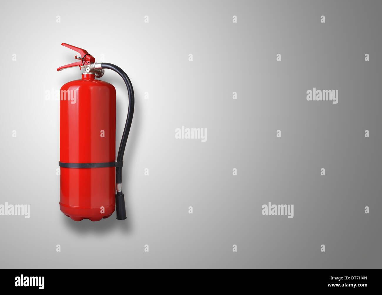 fire extinguisher on gray background Stock Photo - Alamy