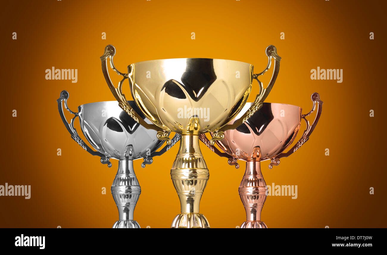 close up champion silver trophy on yellow background Stock Photo - Alamy