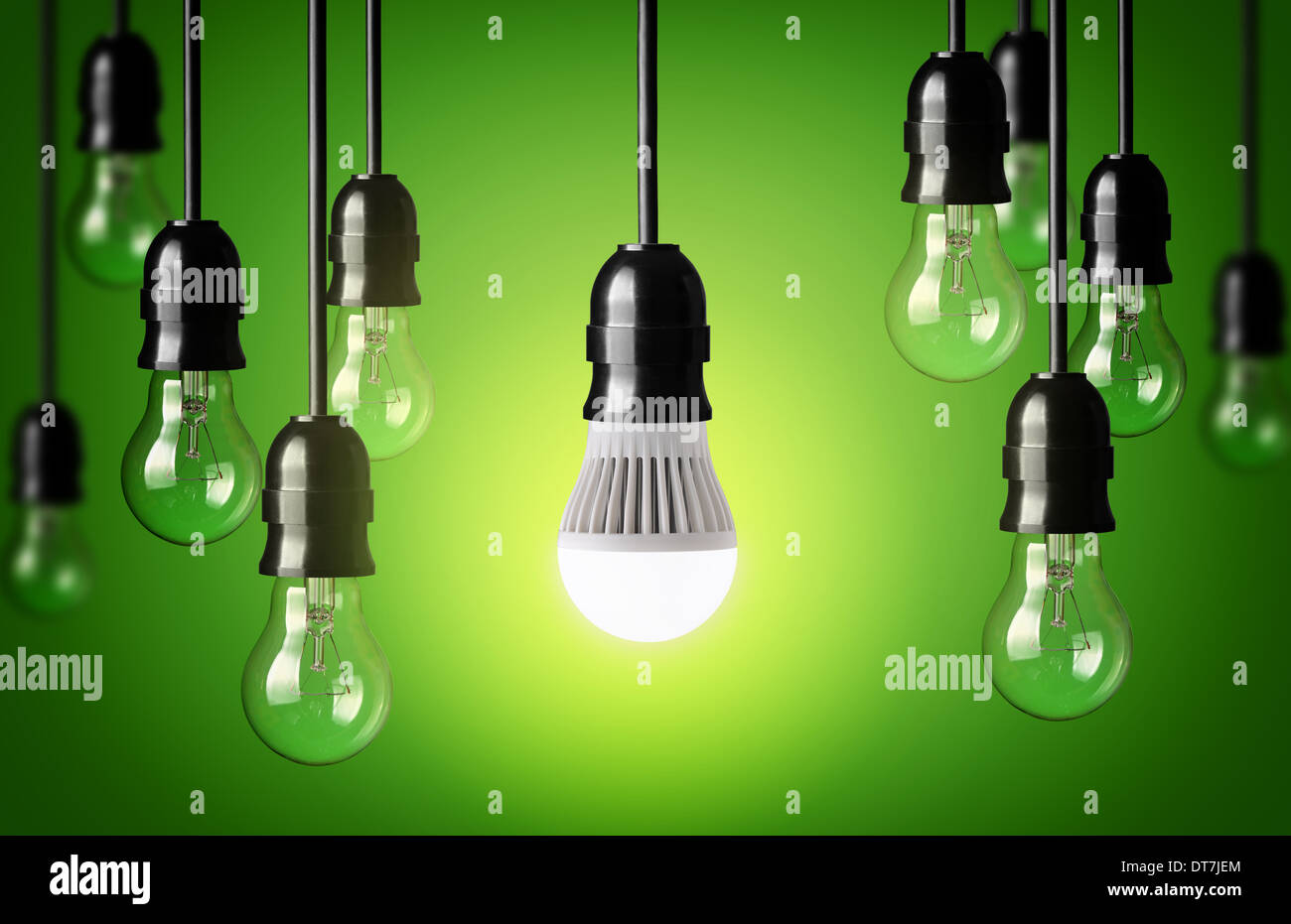 LED bulb and simple light bulbs.Green background Stock Photo - Alamy