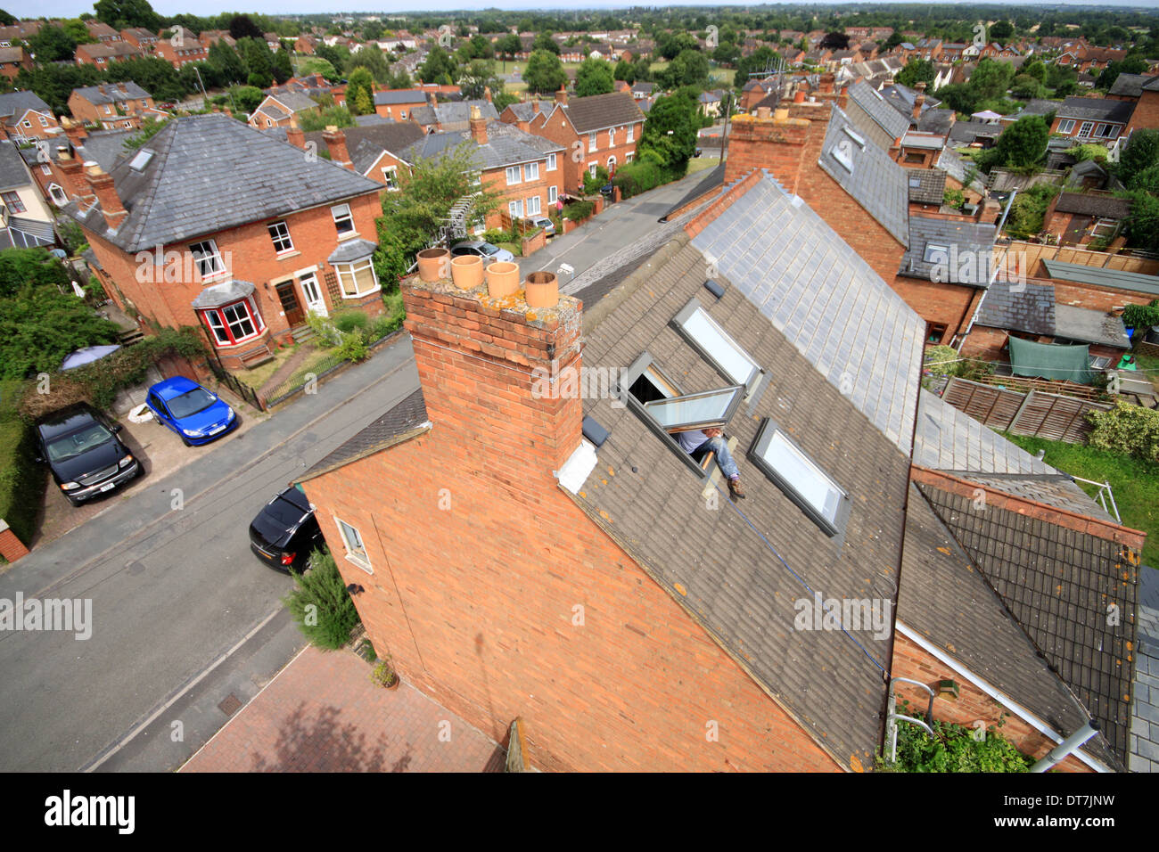 Man climbing out of window hi-res stock photography and images - Alamy
