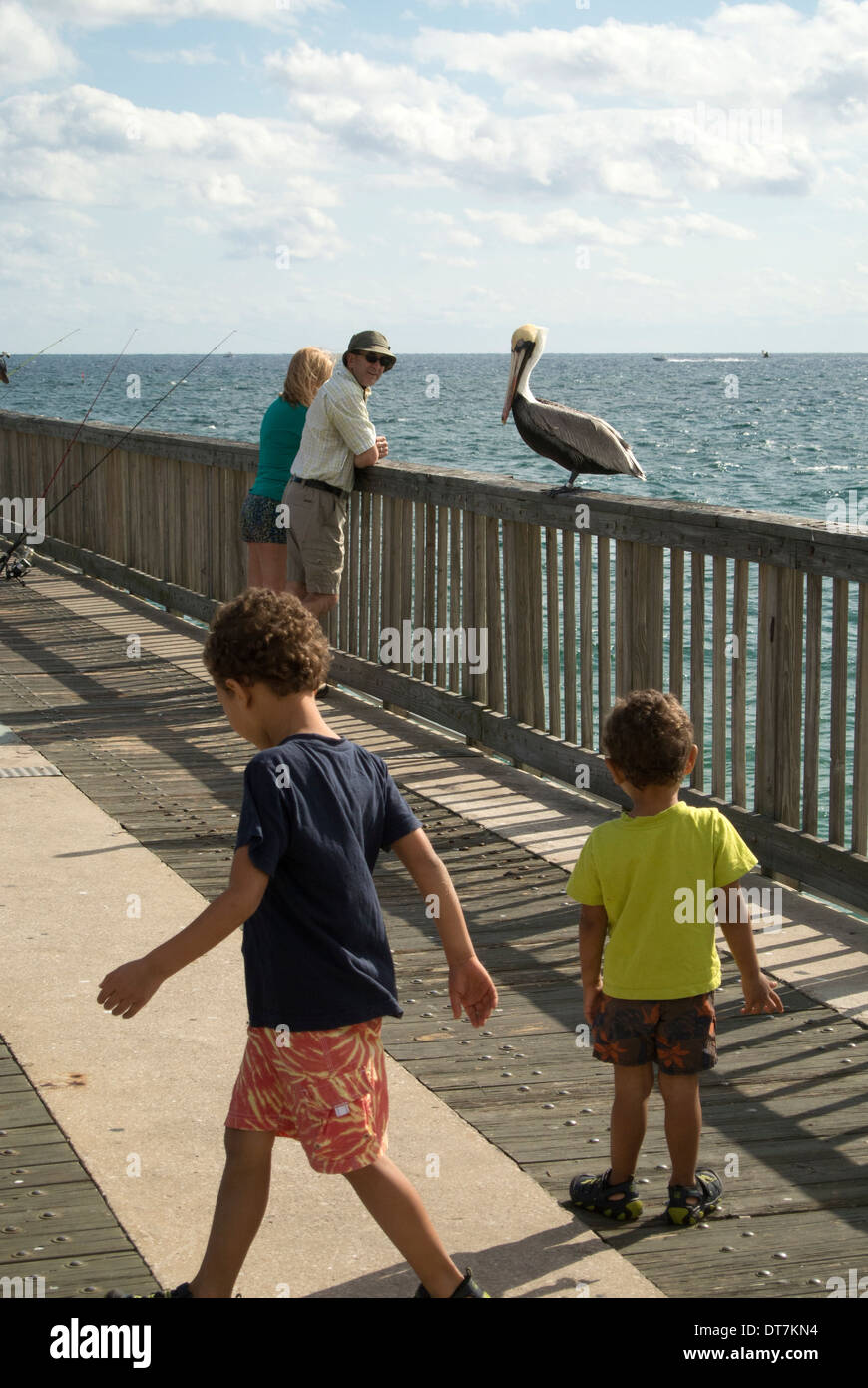 Boys on pier Stock Photo - Alamy