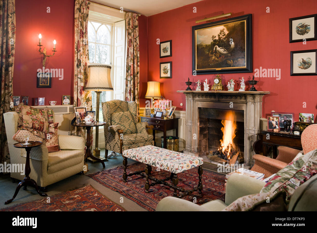 Traditionally furnished drawing room with large open fire Stock Photo ...