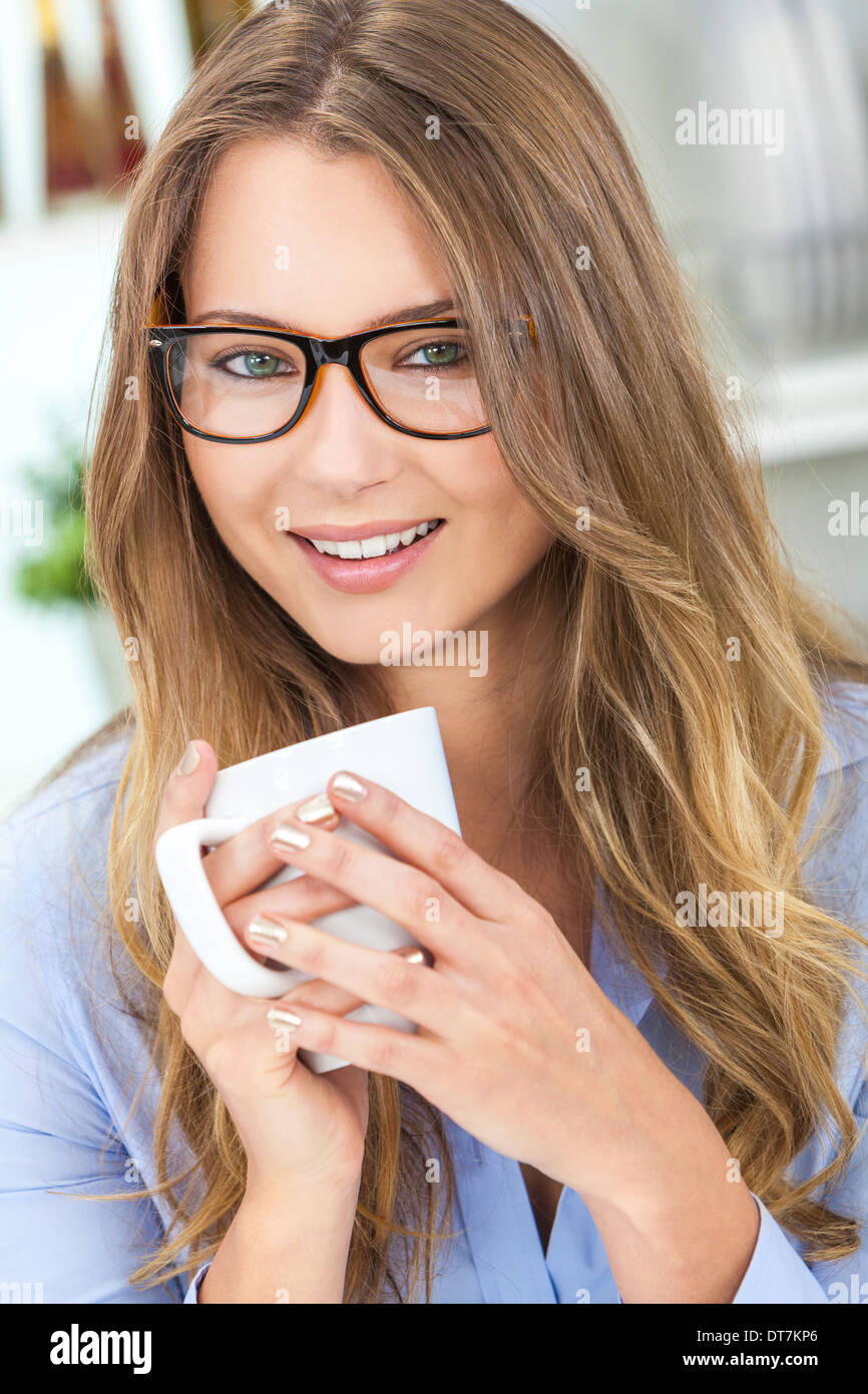 Beautiful blond woman wearing glasses hi-res stock photography and images - Alamy