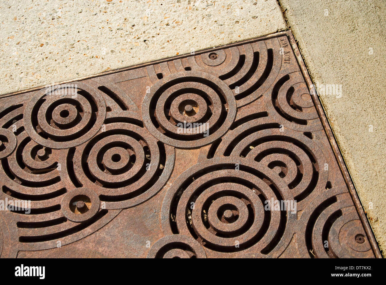 Rusty steel grate on sidewalk Stock Photo - Alamy