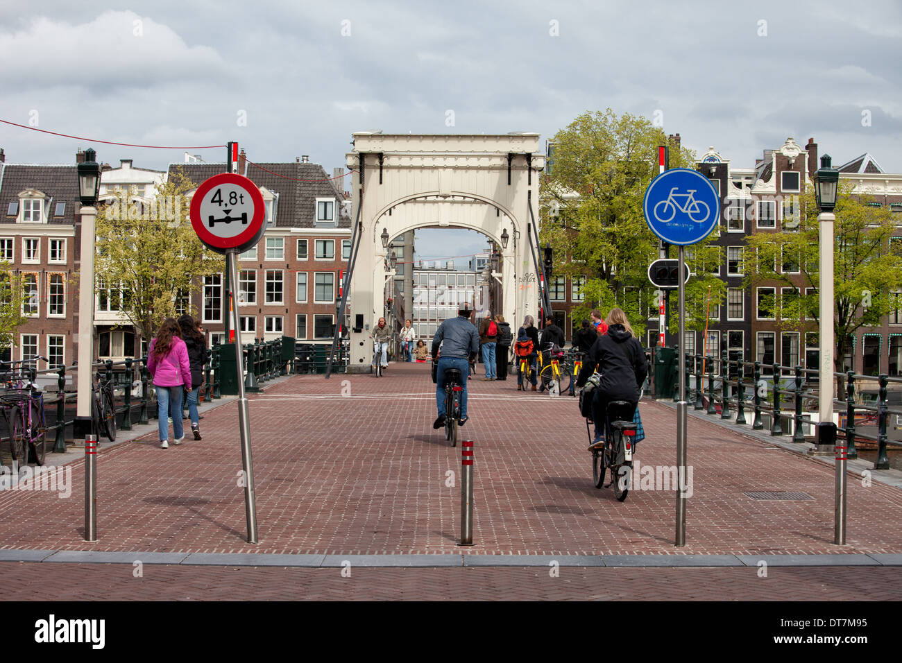 People on Skinny Bridge (Dutch: Magere Brug) over the Amstel river in ...