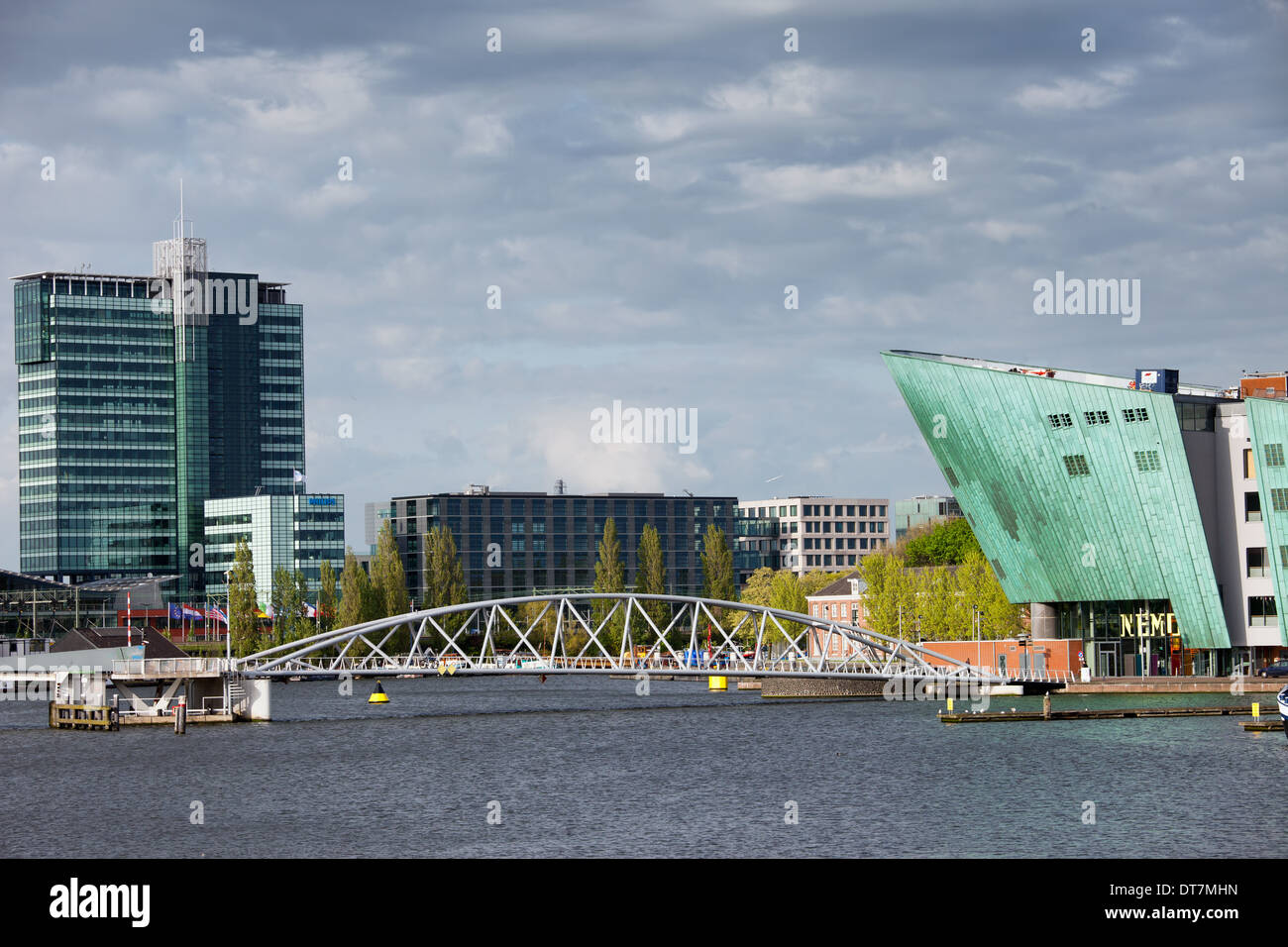 NEMO Science Center and bridge over canal in Amsterdam, Holland ...