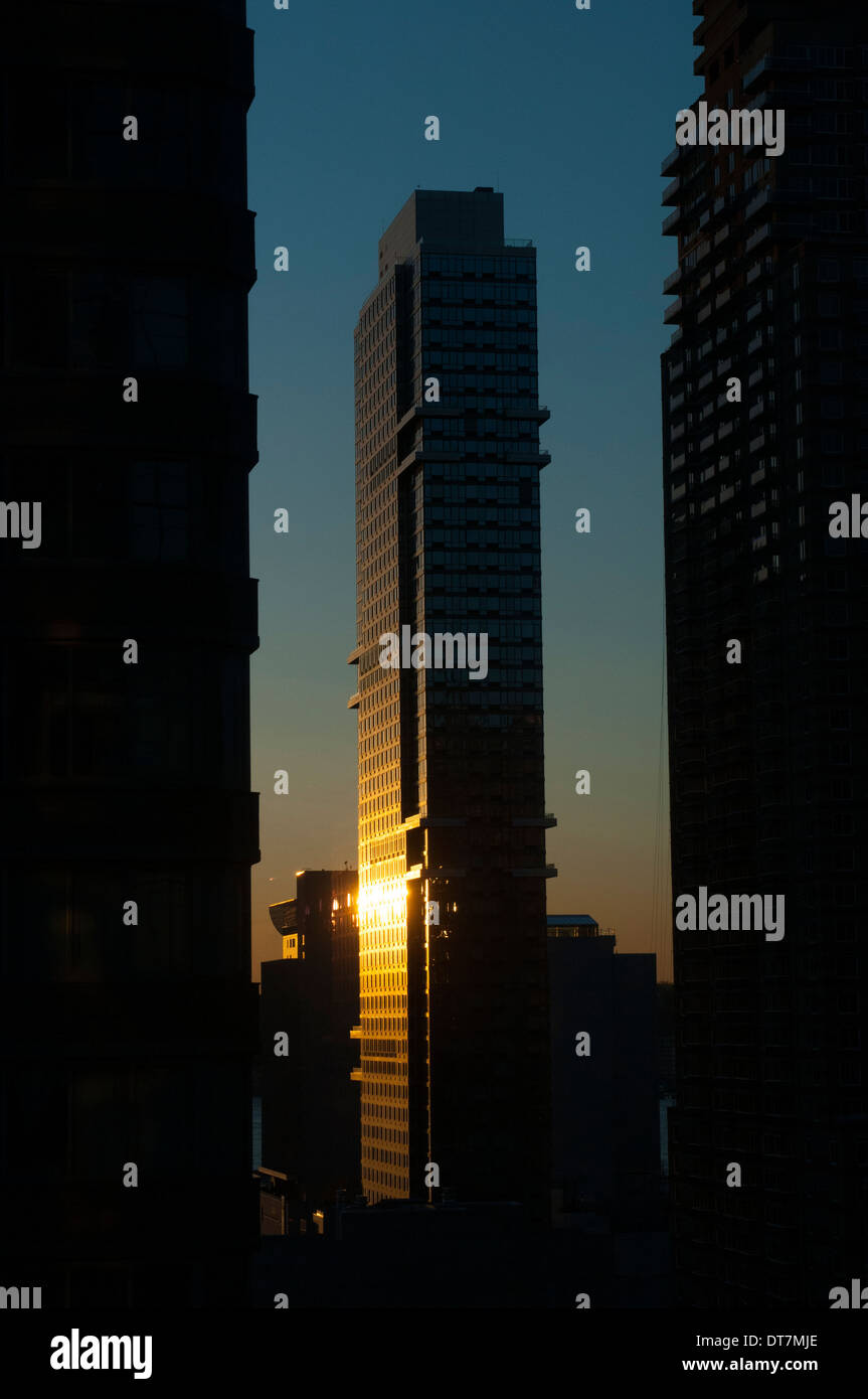 Skyscrapers silhouetted at sunset in Midtown Manhattan New York City ...