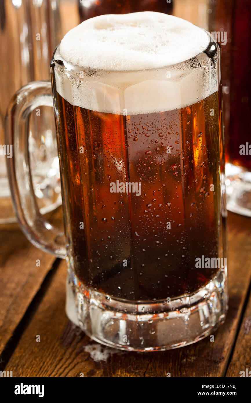 Cold Refreshing Root Beer with Foam in a Mug Stock Photo - Alamy