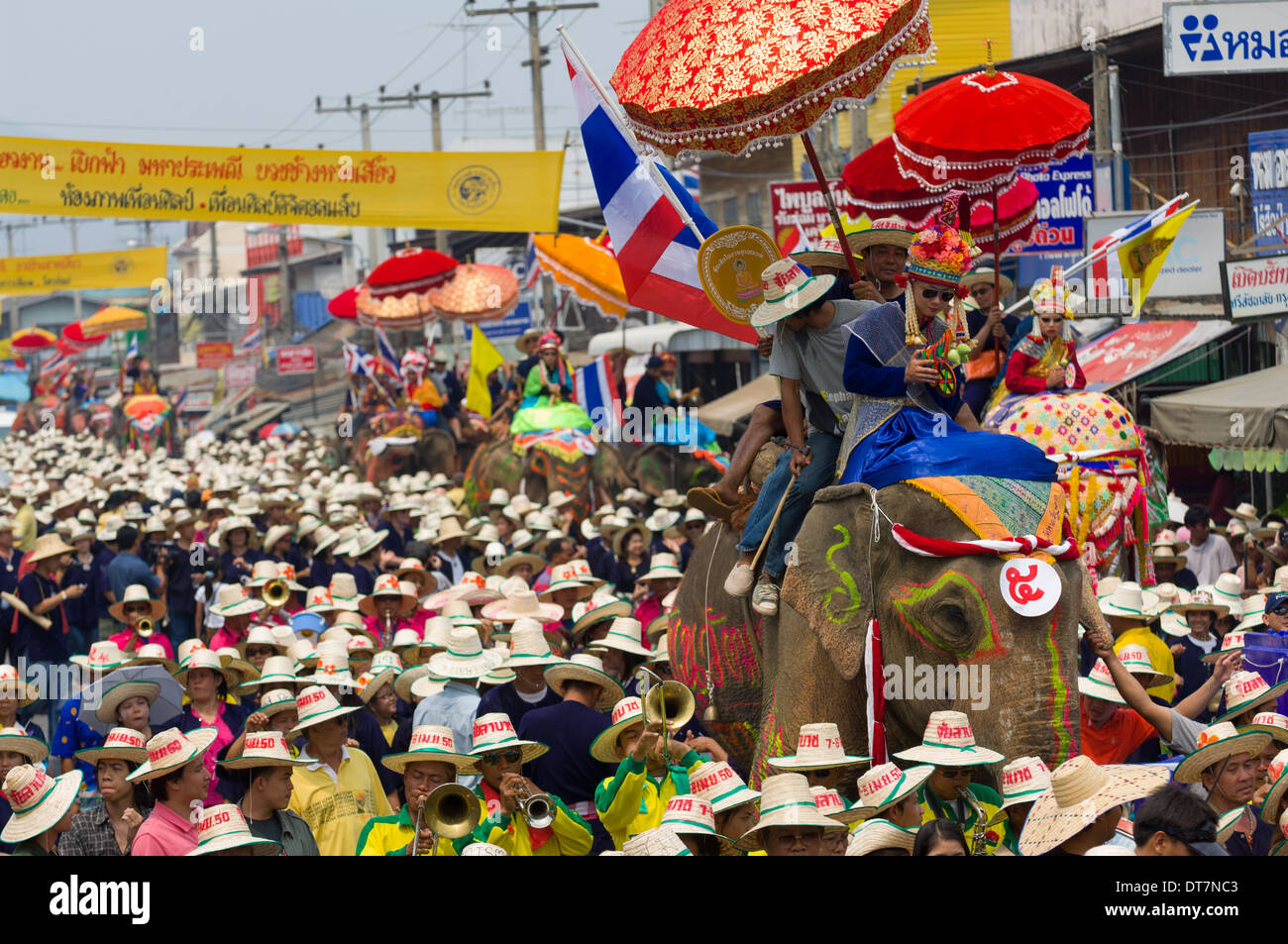 Initiates dressed in garish costumes and sunglasses in procession on ...