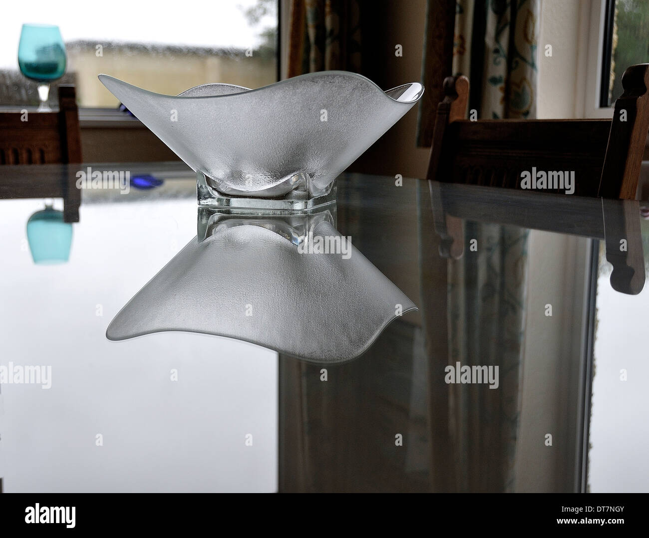 Empty Fruit Bowl on Glass top table Stock Photo - Alamy