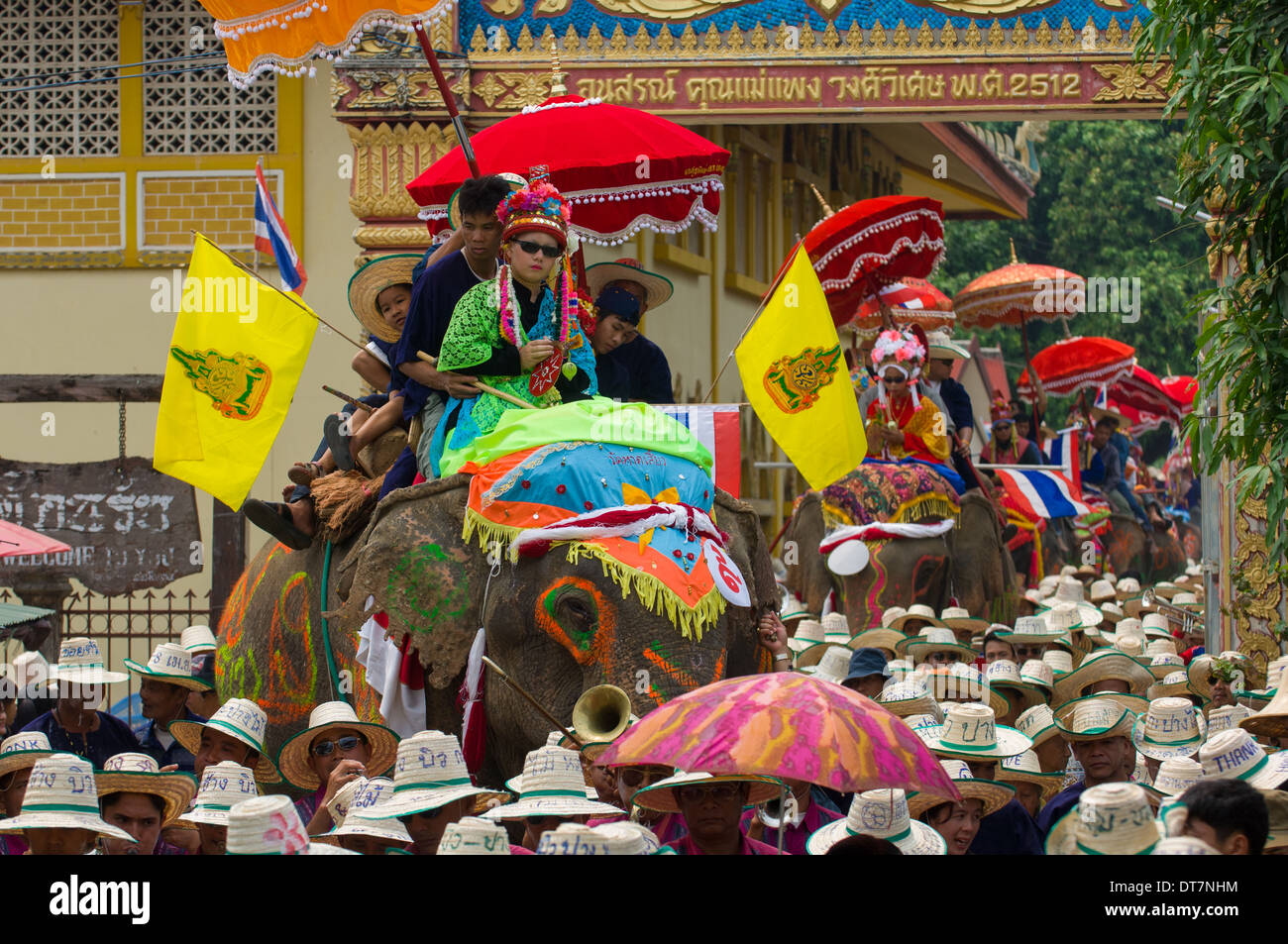 Initiates dressed in garish costumes and sunglasses in procession on ...