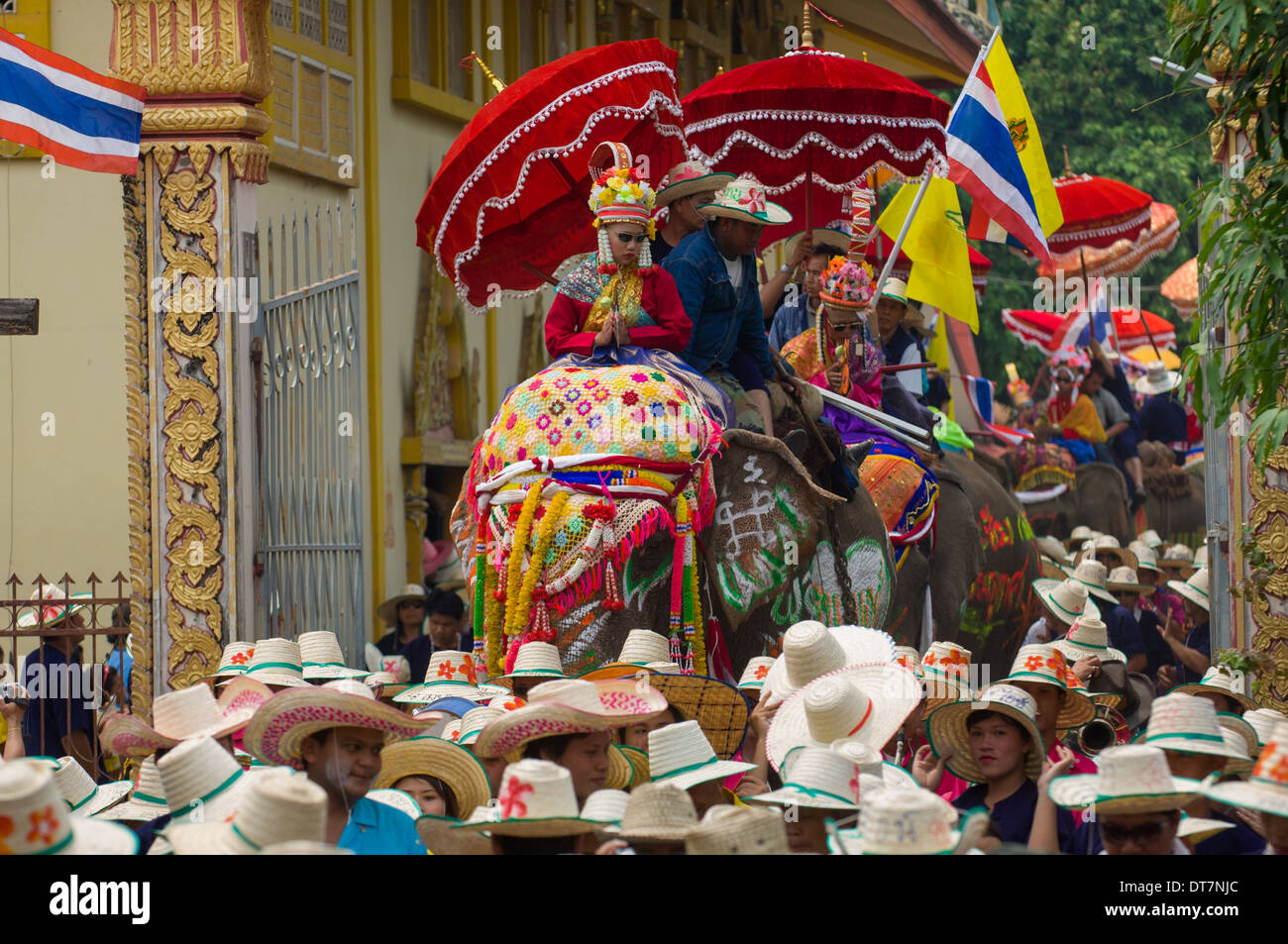 Initiates dressed in garish costumes and sunglasses in procession on ...