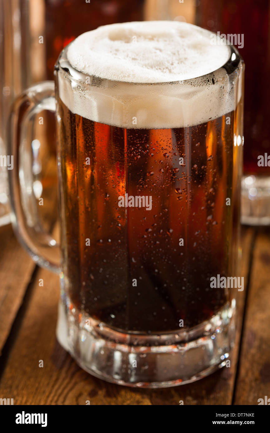 Cold Refreshing Root Beer with Foam in a Mug Stock Photo - Alamy
