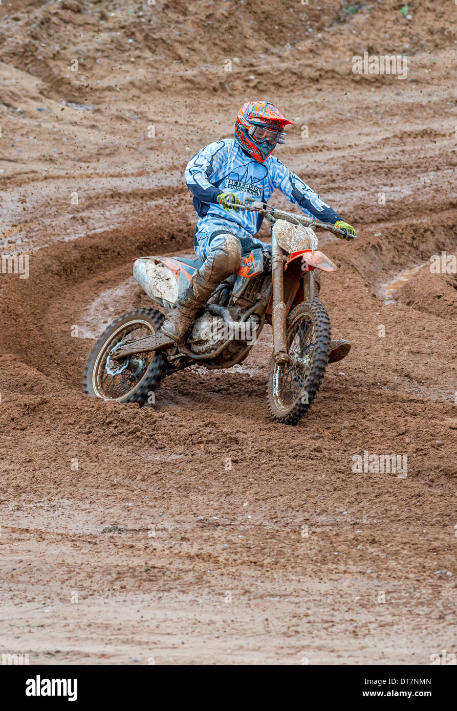 Male riding a moto-x bike on a sandy track Stock Photo - Alamy