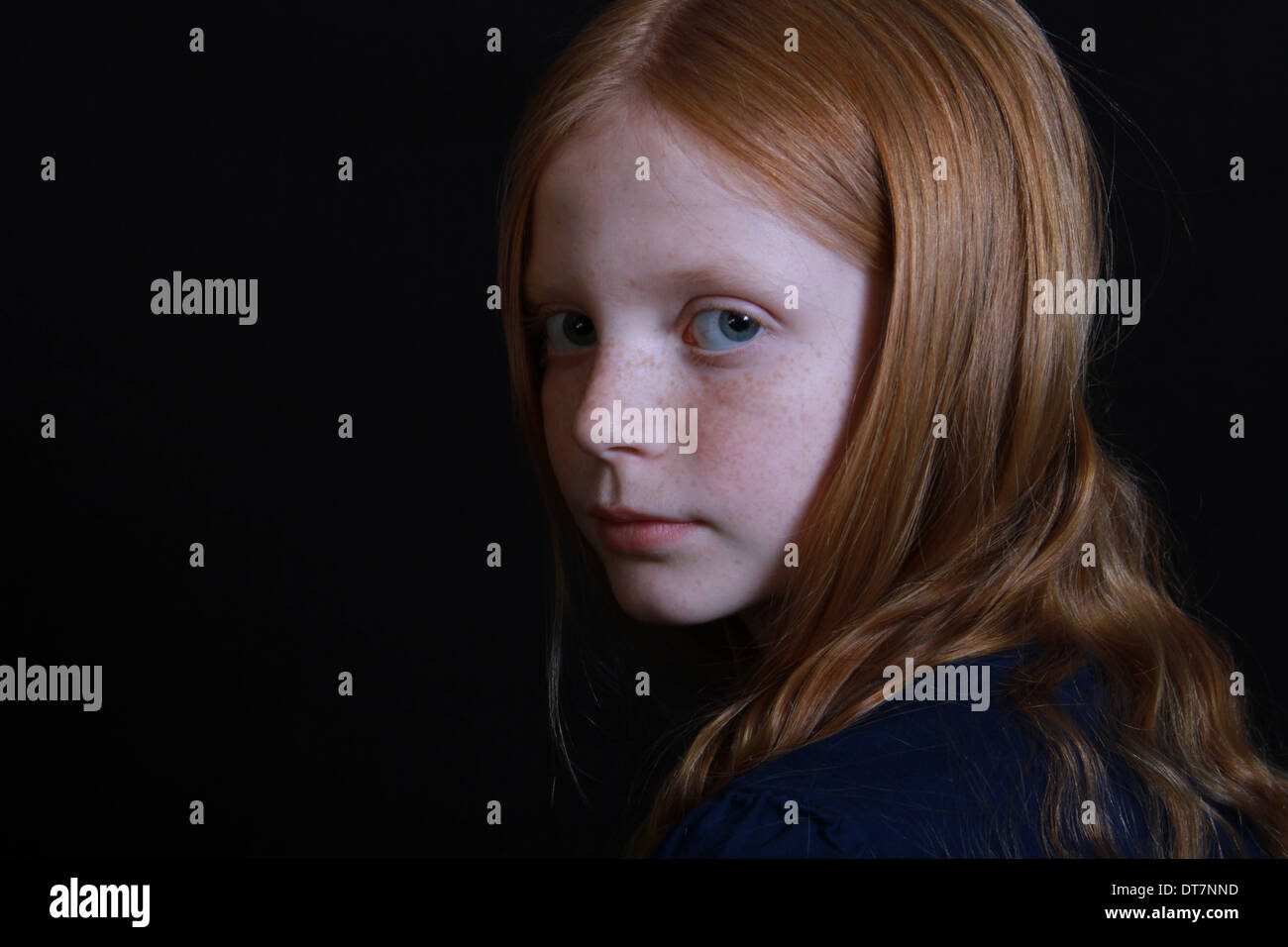 Sad girl looking over shoulder hi-res stock photography and images - Alamy