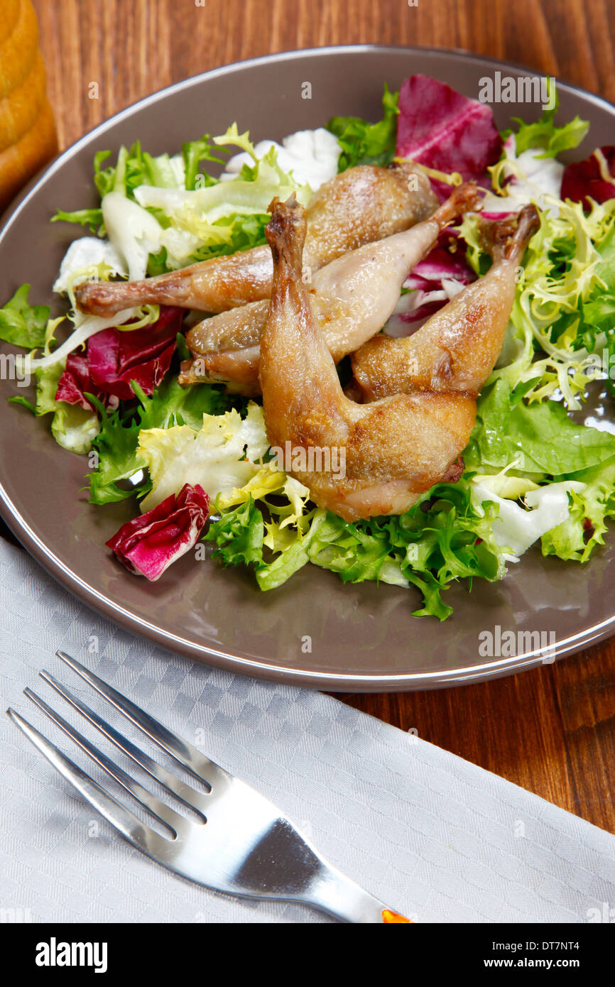 cooked quail and vegetables in a dish Stock Photo - Alamy
