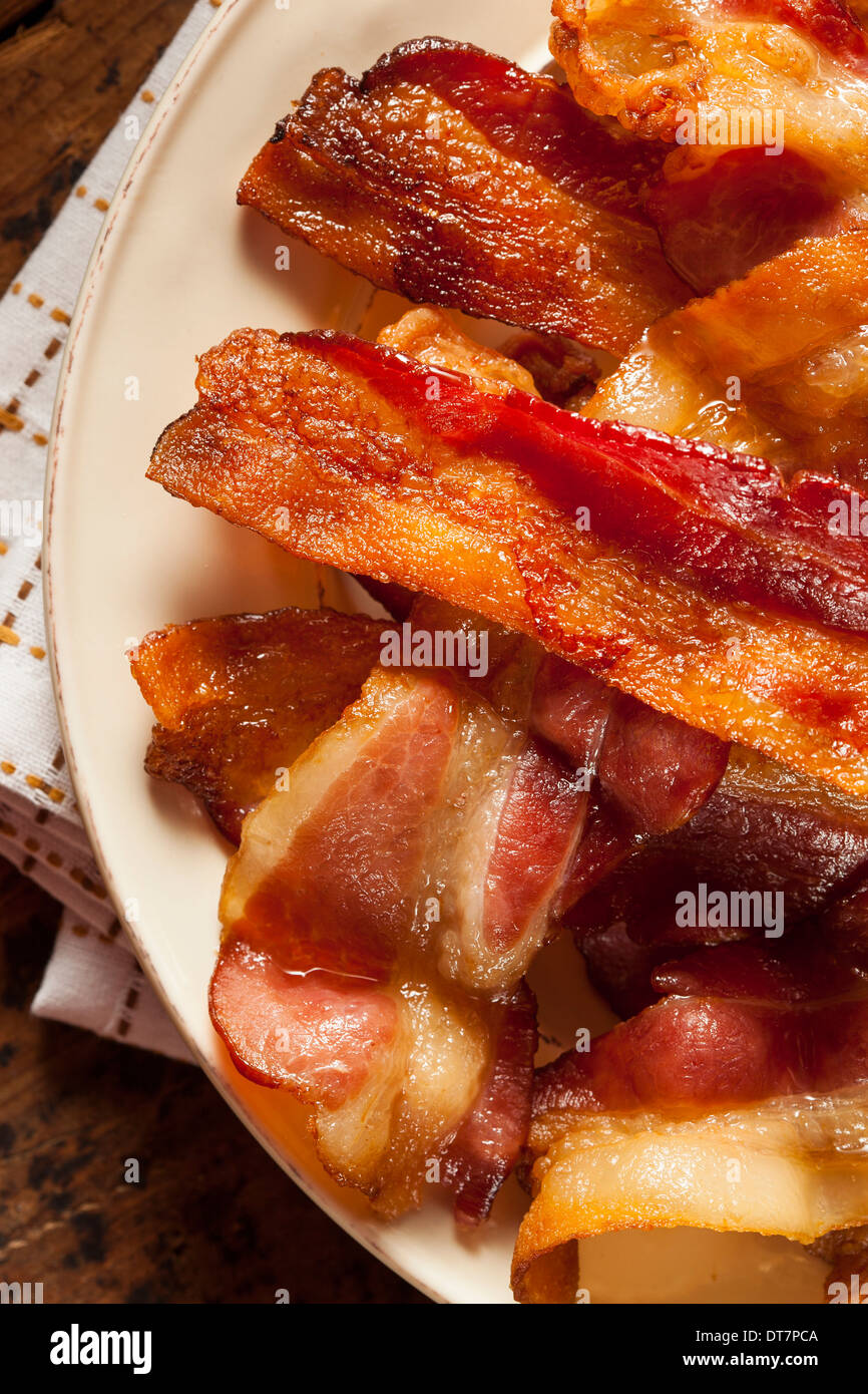 Crispy Organic Unhealthy Bacon on a Background Stock Photo - Alamy