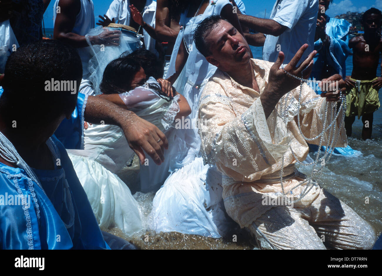 A group of devotees make offerings during the celebration of Yemanyá in ...