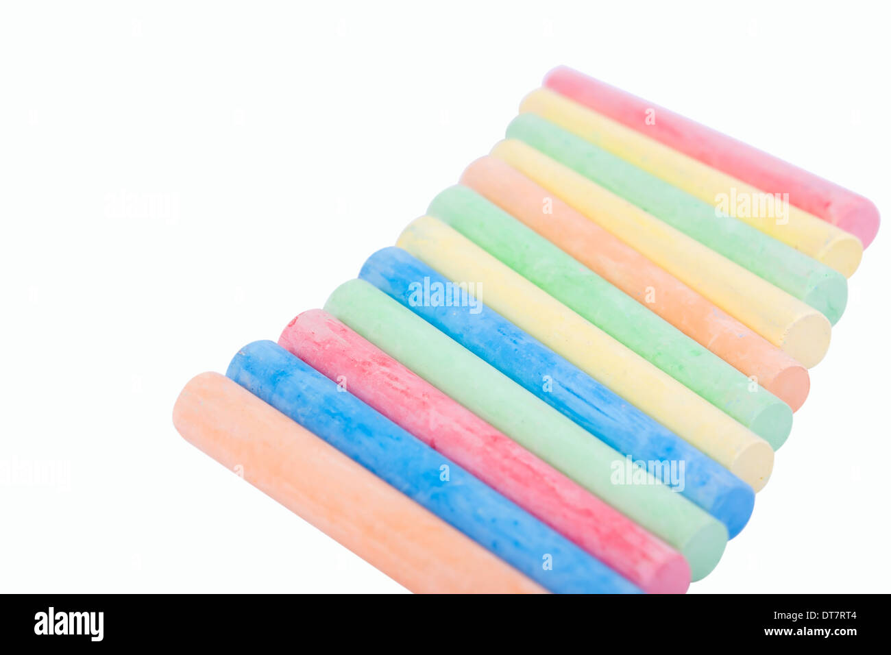 Pastel colored chalk sticks isolated on a white background with ...